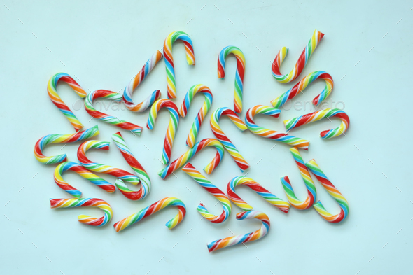 mini cherry candy canes on white background Stock Photo by towfiqu98