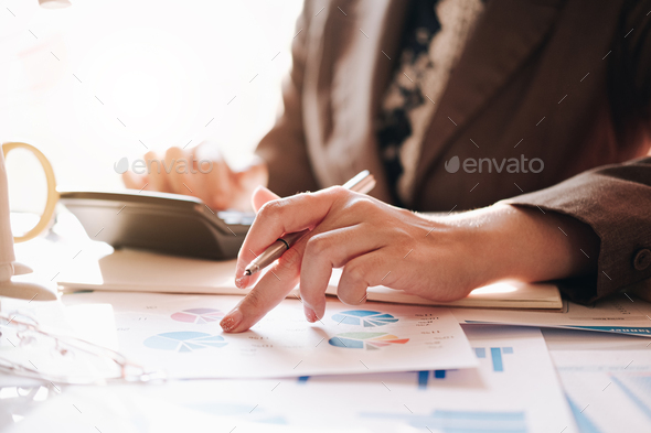 Accountant using a calculator to calculate the numbers. Accounting ...