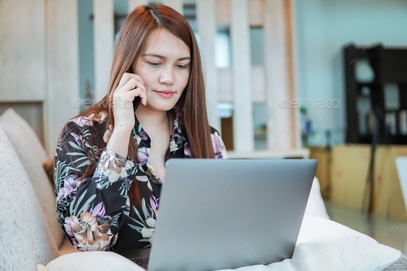 working women use computer laptop on desk, work from home concept ...