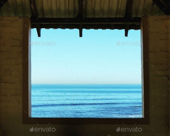 Minimal seascape view through window frame Stock Photo by Angela_Sikiric