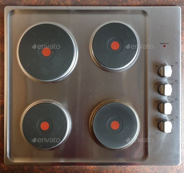Overhead view of electric stove top cooking appliance on stainless ...