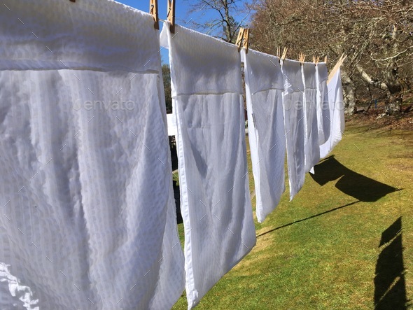 White crisp clean linen on the washing line Stock Photo by bclare2