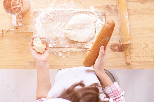 Wooden kitchen table. White flour. Preparation of test. Ready made ...