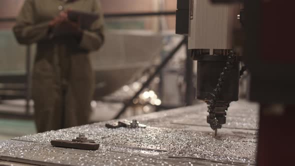 Unrecognizable Person Watching Machine Carving Metal, Stock Footage