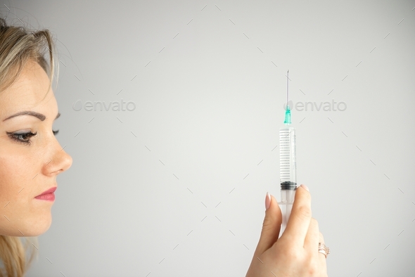 Syringe, medical injection in hand, palm or fingers. Medicine plastic ...