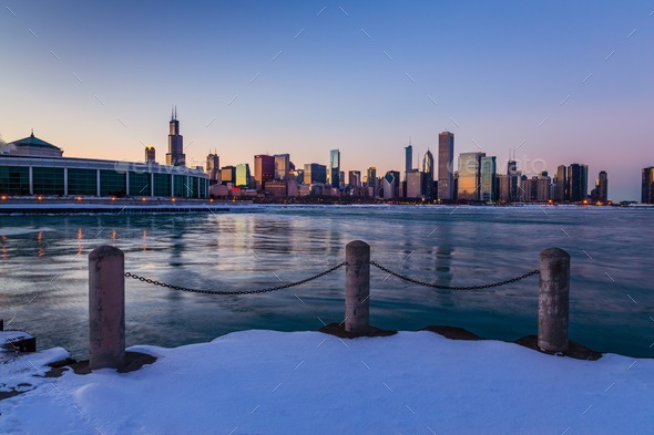Chicago skyline at sunset in the winter. Stock Photo by silviuzid