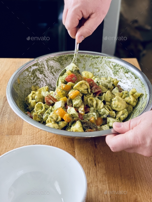 Man mixing bowl of fresh ingredients to serve for meal Stock Photo by ...
