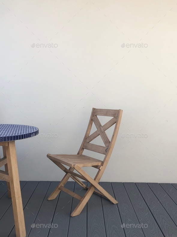 The lone chair and table on rooftop deck Stock Photo by Mrskiac | PhotoDune