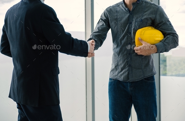 Engineer contractor team handshake after meeting work safety plan ...
