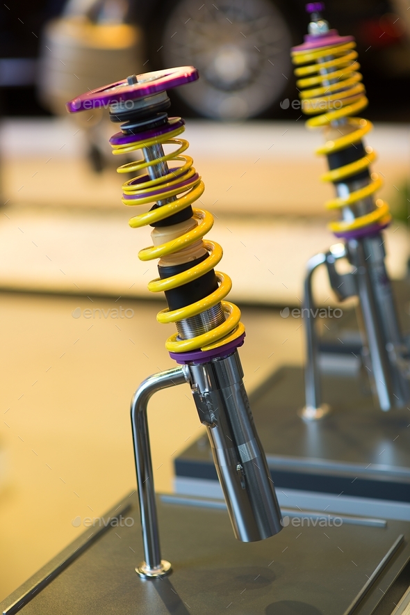 Yellow shock absorbers of car. Stock Photo by zelmab | PhotoDune