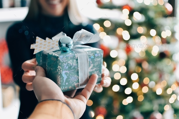 Male hand giving gift to woman Stock Photo by David_Tanke | PhotoDune