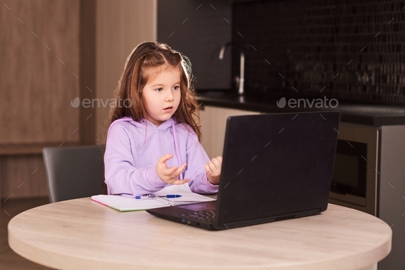 girl count on fingers in front of laptop. girl student online learning ...