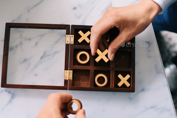 Playing noughts and crosses Stock Photo by David_Tanke | PhotoDune