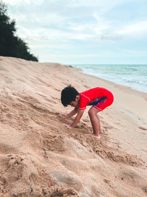 Exploring sand on barefoot Stock Photo by nazmanm | PhotoDune