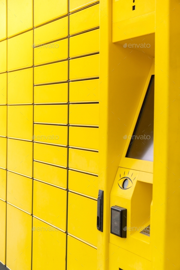 Modern yellow shopping locker. Bar code reader for Skans QR Code on ...