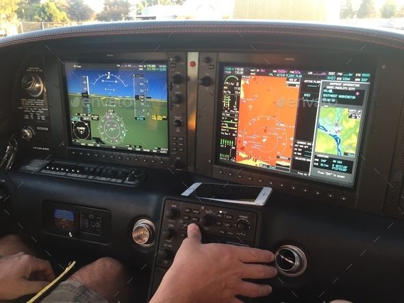 Cockpit of a small engine air plane with someone controlling the ...