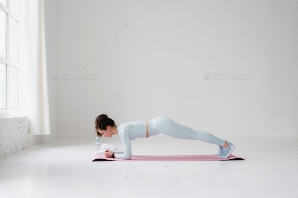 Woman in plank pose on white background. Stock Photo by Ablozhka ...