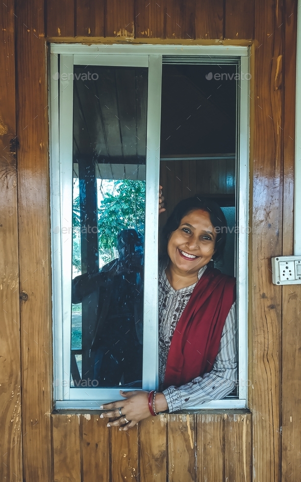 Indian woman through window.... Stock Photo by XandriethXs | PhotoDune