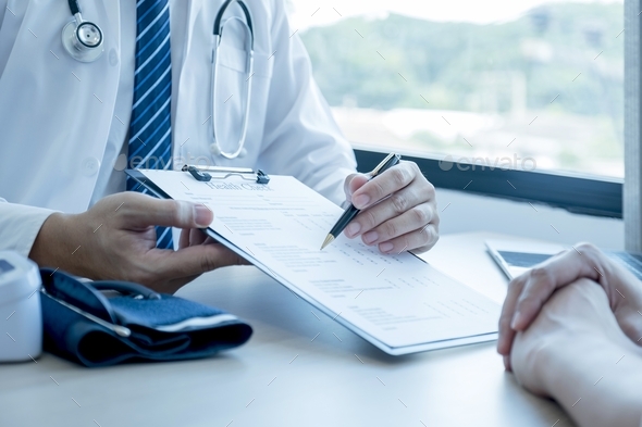 doctor write report and explained health examination results to patient ...