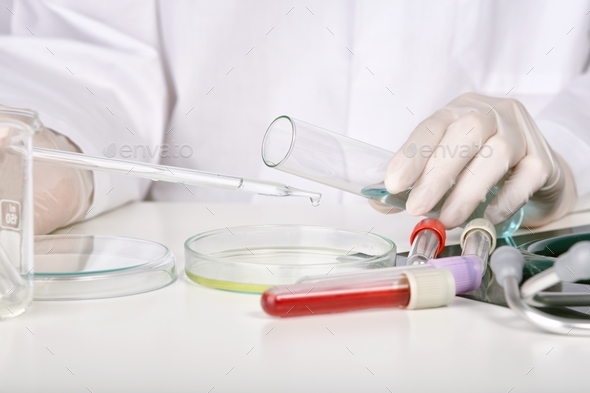 Blood examination testing in hospital laboratory Stock Photo by ARTFULLY79