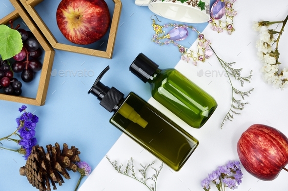 Cosmetic bottle containers with fruit vitamin essence ingredients Stock ...