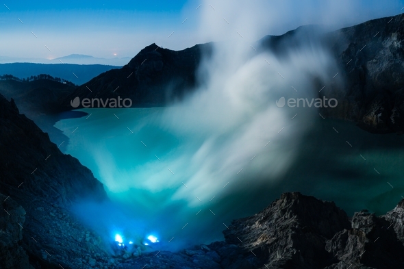 Landscape of Kawah ijen volcano crater with blue flame and acid ...