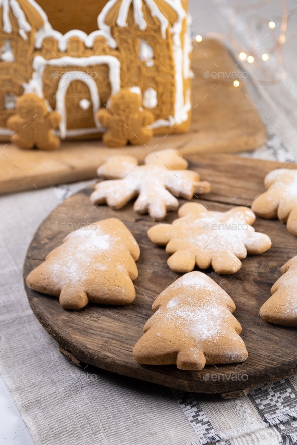 Homemade Christmas baking. Gingerbread cookies and gingerbread house ...