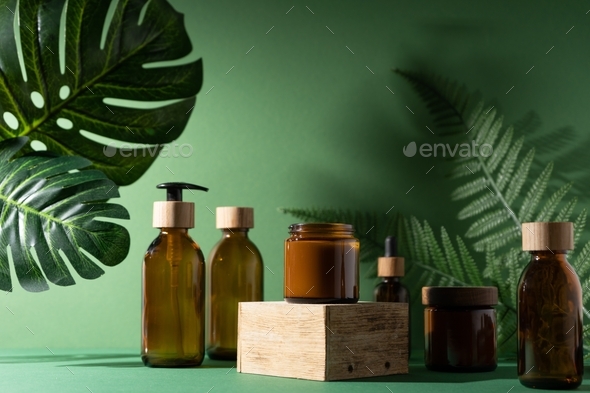 Container for cosmetics. Glass jars with wooden lids. Mast and cream ...