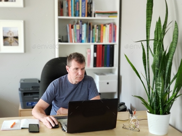 Man is working on computer in home office Stock Photo by polga2 | PhotoDune