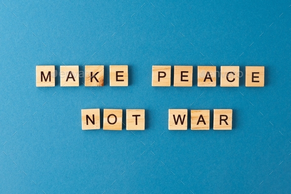 MAKE PEACE NOT WAR background. Phrase from wooden letters. Top view ...