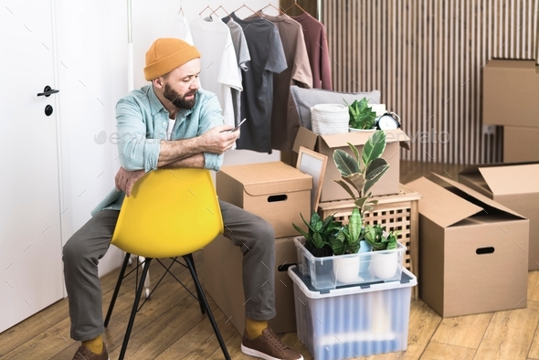 Adult man moving in new apartments. New beginnings concept. Stock Photo ...
