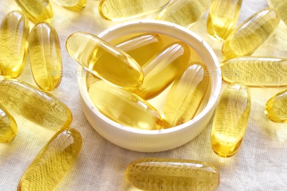 Evening primrose oil in a white plastic cap. Stock Photo by Maliflower73