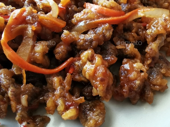 Crispy shredded beef with sweet chilli sauce. Traditional Chinese food ...