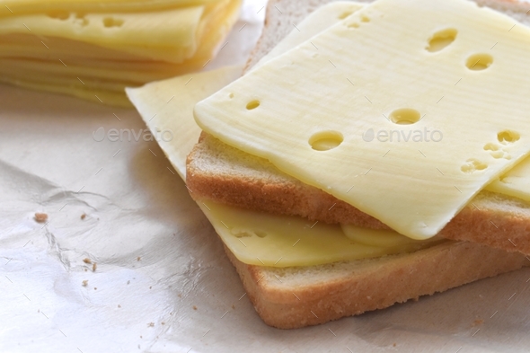 Cheese sandwich. Cheese slices on bread. Stock Photo by Maliflower73