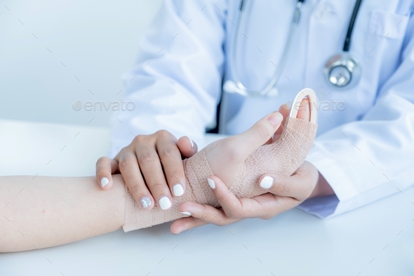 The doctor hands holding patient in arm accident to encourage and ...