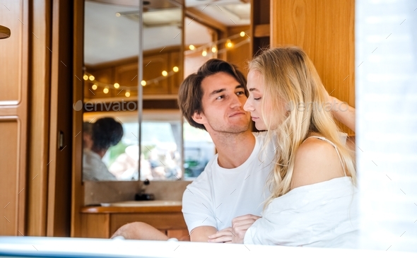 Young just married couple traveling in camper,house on wheels,trailer ...