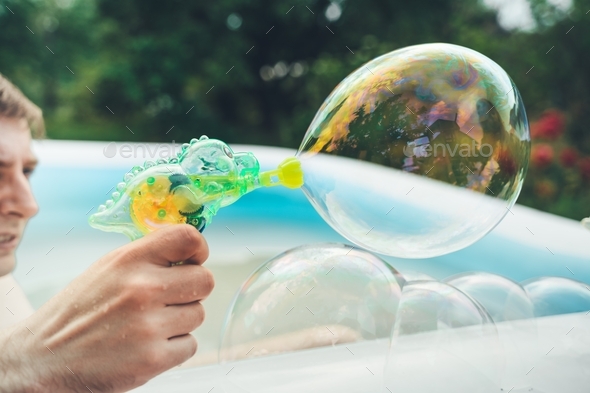 Dinosaur soap bubble gun shooter, blower. Battle, party in swimming ...