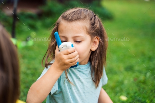 Small girl,kid play in walkie-talkie.Walkie Talkies with channels.Game ...