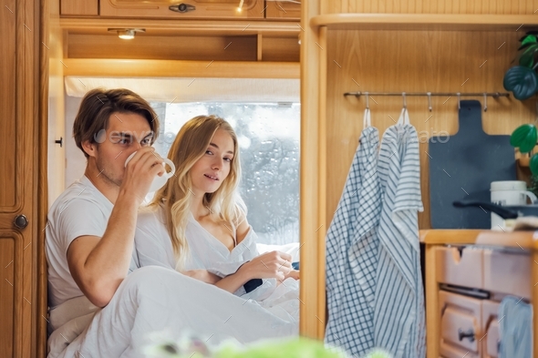 Young just married couple traveling in camper,house on wheels,trailer ...