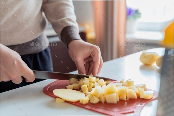 Cooking man, father, cooker. Preparation of soup, lunch, dinner in ...