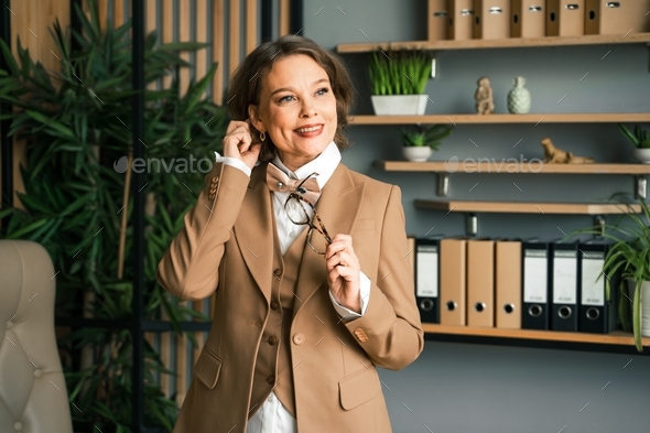 Confident stylish mature middle aged elderly woman in office. General ...