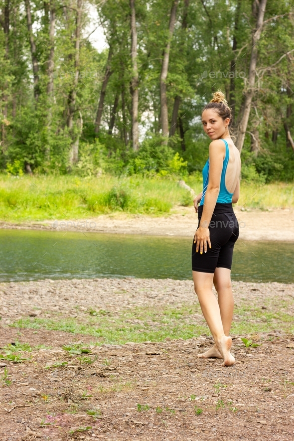 sports girl in a blue swimsuit river bank Stock Photo by aira003 ...