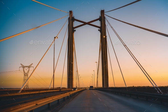 Driving over bridge at sunset Stock Photo by sintiaweber | PhotoDune