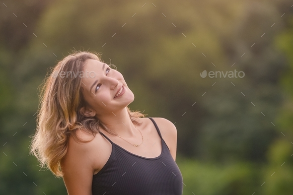 Smiling girl looking up Stock Photo by sintiaweber | PhotoDune
