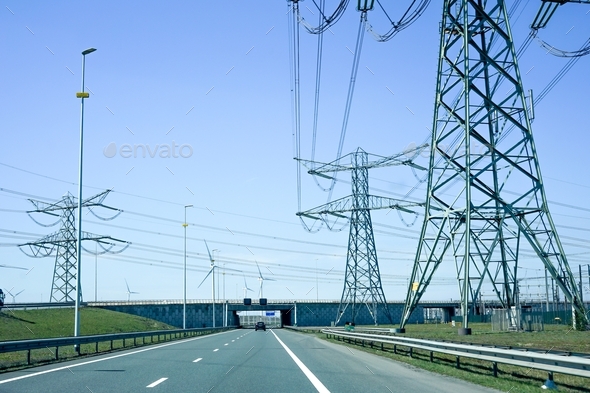 High-voltage electricity towers along the highway. Stock Photo by ...