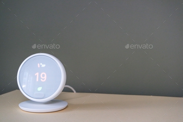 Modern smartphone or tablet operated thermostat. Temperature control ...