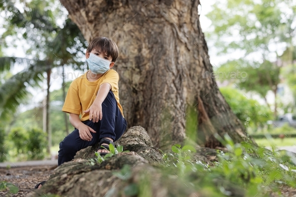 Child Under a Tree Stock Photo by thanyapatm | PhotoDune