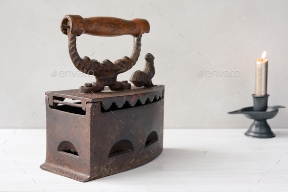 Antique cast-iron coal heated pressing iron with wood handle. Vintage ...