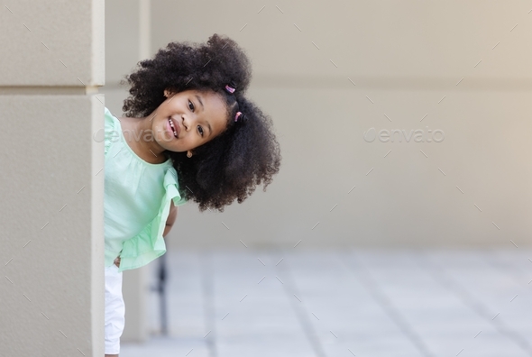 adorable girl afro smile happy curly-hair shy Little girl sit alone and ...