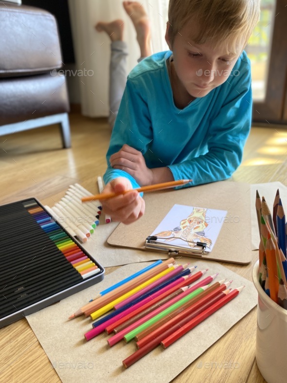 Boy drawing Stock Photo by elenabednykh | PhotoDune